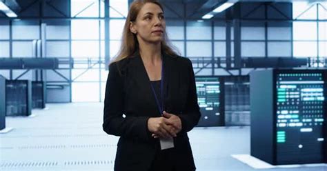 Admin Walking In Data Center Monitoring Systems Technology Stock