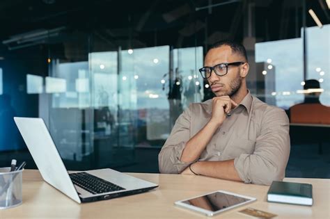 Premium Photo Thinking Hindu Businessman In Glasses Male Programmer