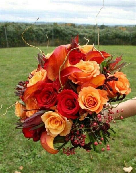 Autumn Wedding Bouquet Comprised Of Red Roses Orange Roses Flame