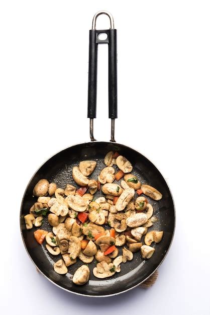 Premium Photo Sauteed Mushroom Or Fried Toadstool In A Frying Pan Over Moody Background