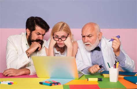 Group Of Business People Analyzing Reports On Computers Busy Diverse Millennial Team Discussing
