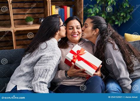 Three Woman Surprise With T Sitting On Sofa At Home Stock Image