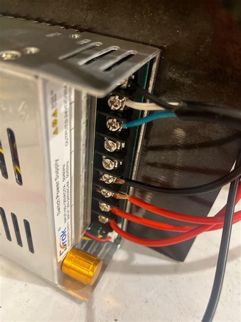 Power Source Works Fine With No Load But When I Connect Part Of My Circuit The Ground Wire Gets