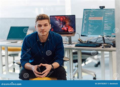 Programming Man Working On Computer In It Office Sitting At Desk Writing Codes Stock Image