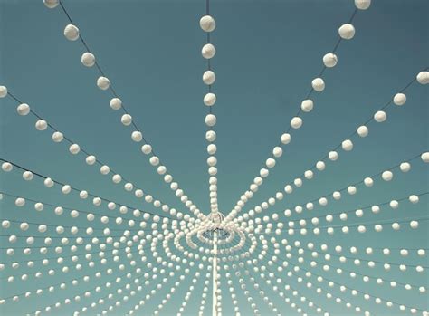 Low Angle View Of Lighting Decoration Against Sky Premium Photo