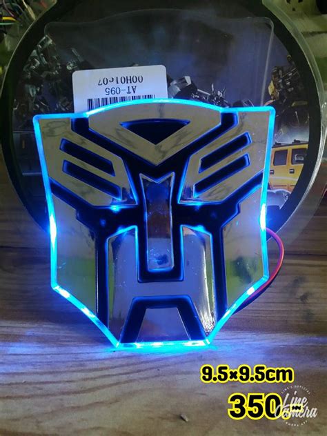 โลโก้ทรานฟอเมอร์ แบบมีไฟ เข้าแล้วนะคะ สีขาว สีน้ำเงิน สีแดง สีส้ม 👌ขนาด 9 5×9 5cm มีขนาดเดียว