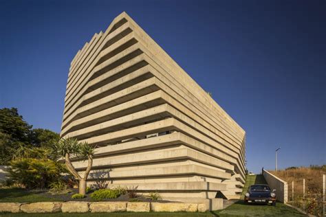 Contaminar Stacks Concrete Layers To Enclose Twisting Portuguese Home