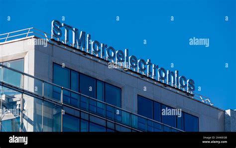 sign on top of a building with the name of stmicroelectronics written