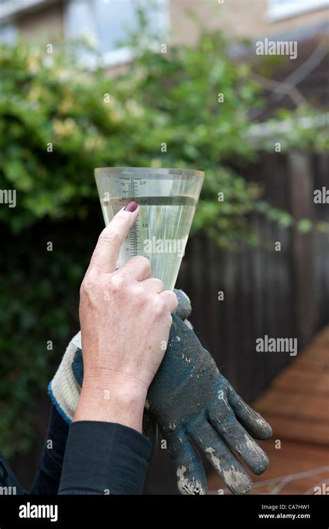 Garden Rain Gauge For Measuring The Amount Of Rainfall Stock Photo Alamy