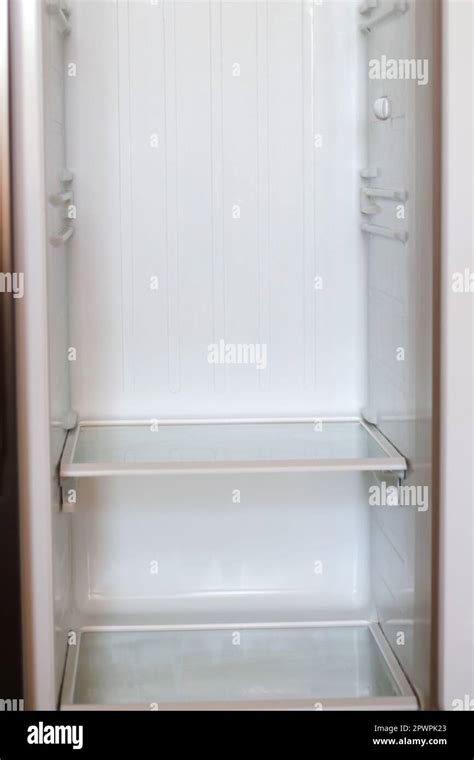 Empty Open Fridge With Shelves Refrigerator Inside Of An Empty White Fridge Vertical Closeup