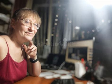 Mature Blonde Woman Taking A Candid Selfie During An Evening At Her