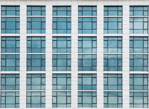 Premium Photo The Glass Window Pattern On The Building Wall With The