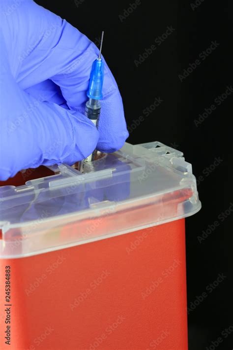 Hospital Staff Using A Sharps Container For Bio Hazard Waste Stock Photo Adobe Stock