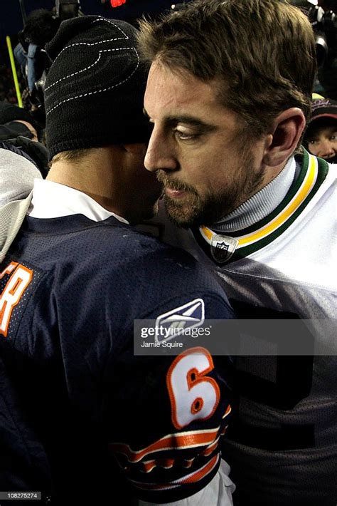Quarterback Aaron Rodgers Of The Green Bay Packers Hugs Jay Cutler Of