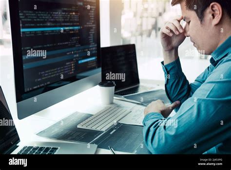 Software Developers Headache With Code Analysis In The Office Stock