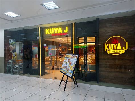 Facade Of Kuya J Restaurant In Quezon City Philippines Photo Background