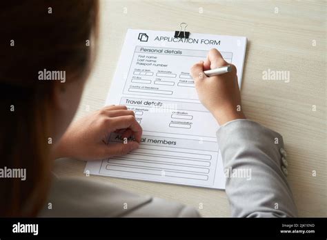 Business Lady Filling Application Form View Over The Shoulder Stock Photo Alamy