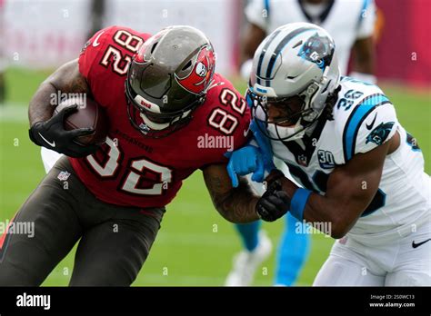Tampa Bay Buccaneers Tight End Devin Culp Is Tackled By Carolina Panthers Safety Demani