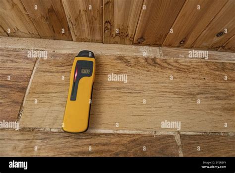 A Timber Moisture Detector Is Seen Close Up With Copy Space During An