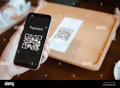 Hand Using Mobile Phone Application To Scan Qr Code Hands Holding Mobile Phone Qr Code Payment