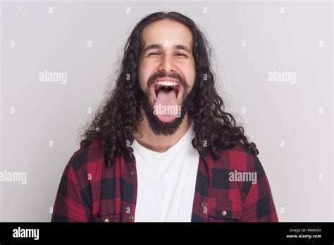 Crazy Handsome Man With Beard And Black Long Curly Hair In Casual Style