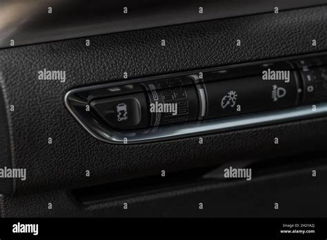 Hand Operating ESP Electronic Stability Program Control Close Up View Interior Detail Of A