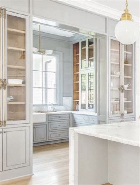 Brass Cremone Bolt Hardware On Glass Kitchen Cabinets Transitional
