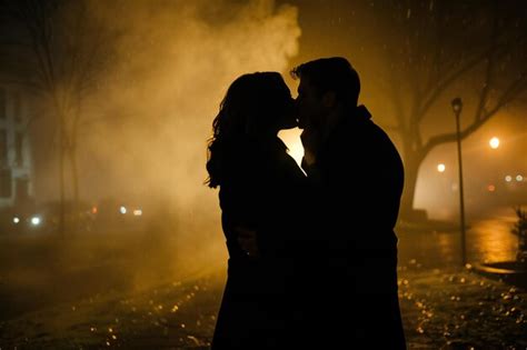 A Couple Kissing In The Dark With Smoke Coming Out Of Them Premium Ai