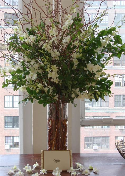 This Is An Arrangement Featuring White Dendrobium Orchids With Accents