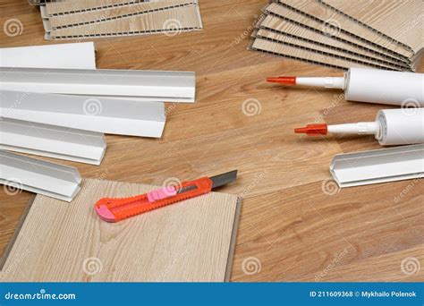 Set Of Items For Pvc Ceiling Indoor Works Assembly Adhesive Bottles And Pvc Panels Indoor Vpc