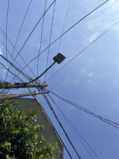 A Utility Pole Stands Against A Clear Blue Sky Stock Image Image Of
