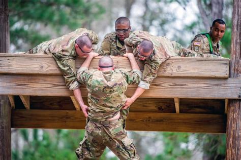 Us Army Trainees Negotiate A Confidence Course On Sand Hill During