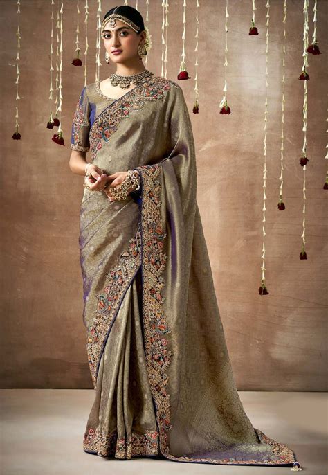 Metallic Blue Tissue Dola Silk Embroidered Wedding Saree With Blouse