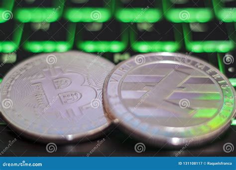 Cryptocurrency Coins On Illuminated Computer Keyboard Stock Image