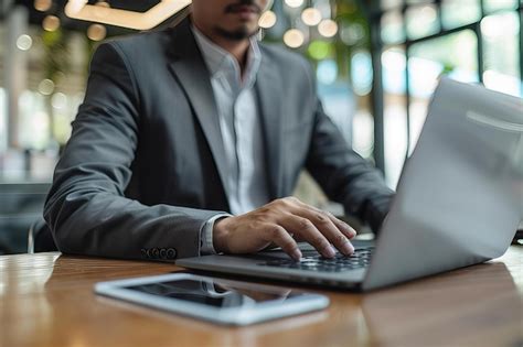 Premium Photo Man In Suit Using Laptop Computer