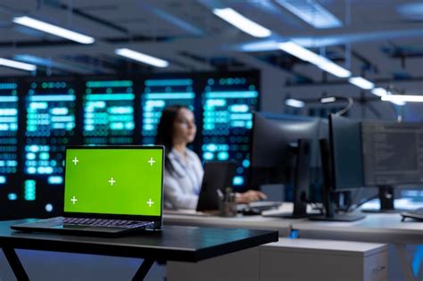 Premium Photo Focus On Green Screen Laptop In Data Center Facility