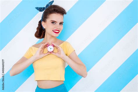 Sexy Surprised Woman With Alarm Clock In Hands And Open Mouth Colorful