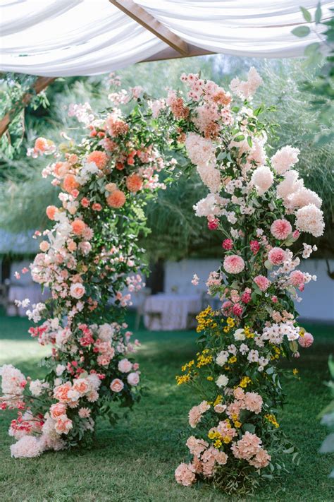 Outdoor Wedding Ceremony With Floral Arch Decor