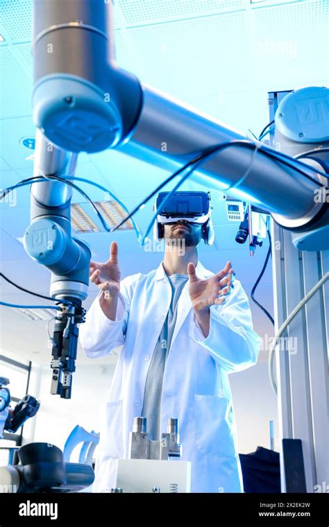 Robotic Arm With Artificial Vision Researcher With Virtual Reality Glasses VR Humanoid Robot