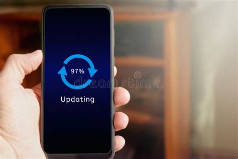 Male Male Hand Holding Mobile Phone Showing Update Interface And Icon