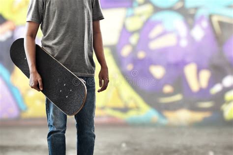 Man Holding Skateboard At Skatepark Stock Image Image Of Casual