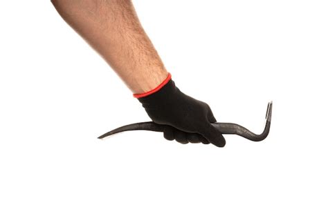 Premium Photo Metal Black Crowbar In A Man39s Hand On A White Background Isolate Closeup