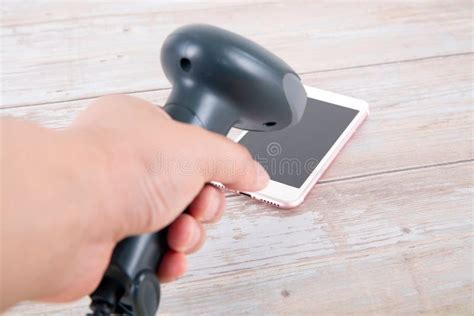 Hand Held Scanner To Scan The QR Code On The Mobile Phone To Charge Stock Photo Image Of