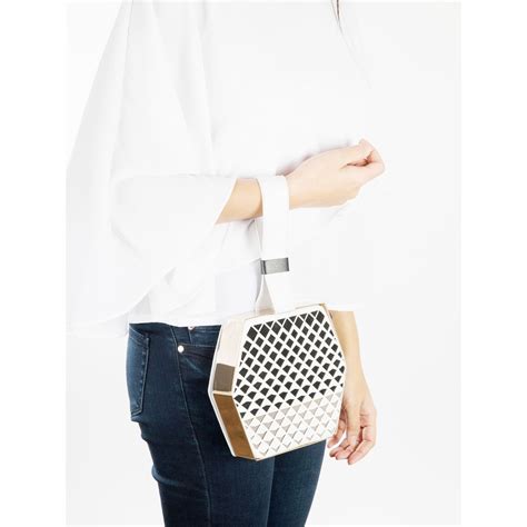 Buy Devina Juneja Angular Story Hexagon Cutwork Wristlet In White