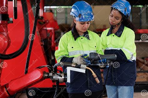 Woman Engineer Controlling And Checking Robot Arm At Factory Technology Automation Innovation