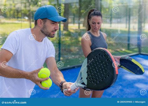 Male Coach Teaching Woman Personalized Instruction In A Supportive Environment Stock Image