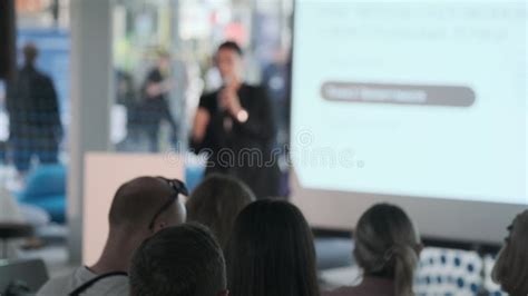 Speaker Presenting At A Conference In Front Of Engaged Audience Stock