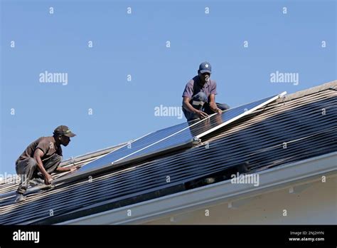 Team Installing Hybrid Grid Tied Electrical Installation Of Solar