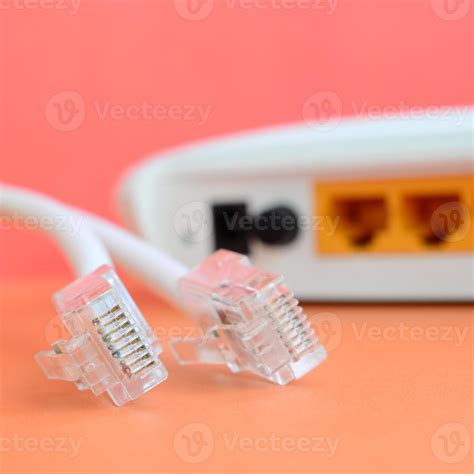 Internet Router And Internet Cable Plugs Lie On A Bright Orange Background Items Required For