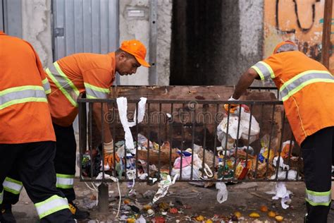 Keeping The City Clean A Team Of Garbage Collectors Stock Image